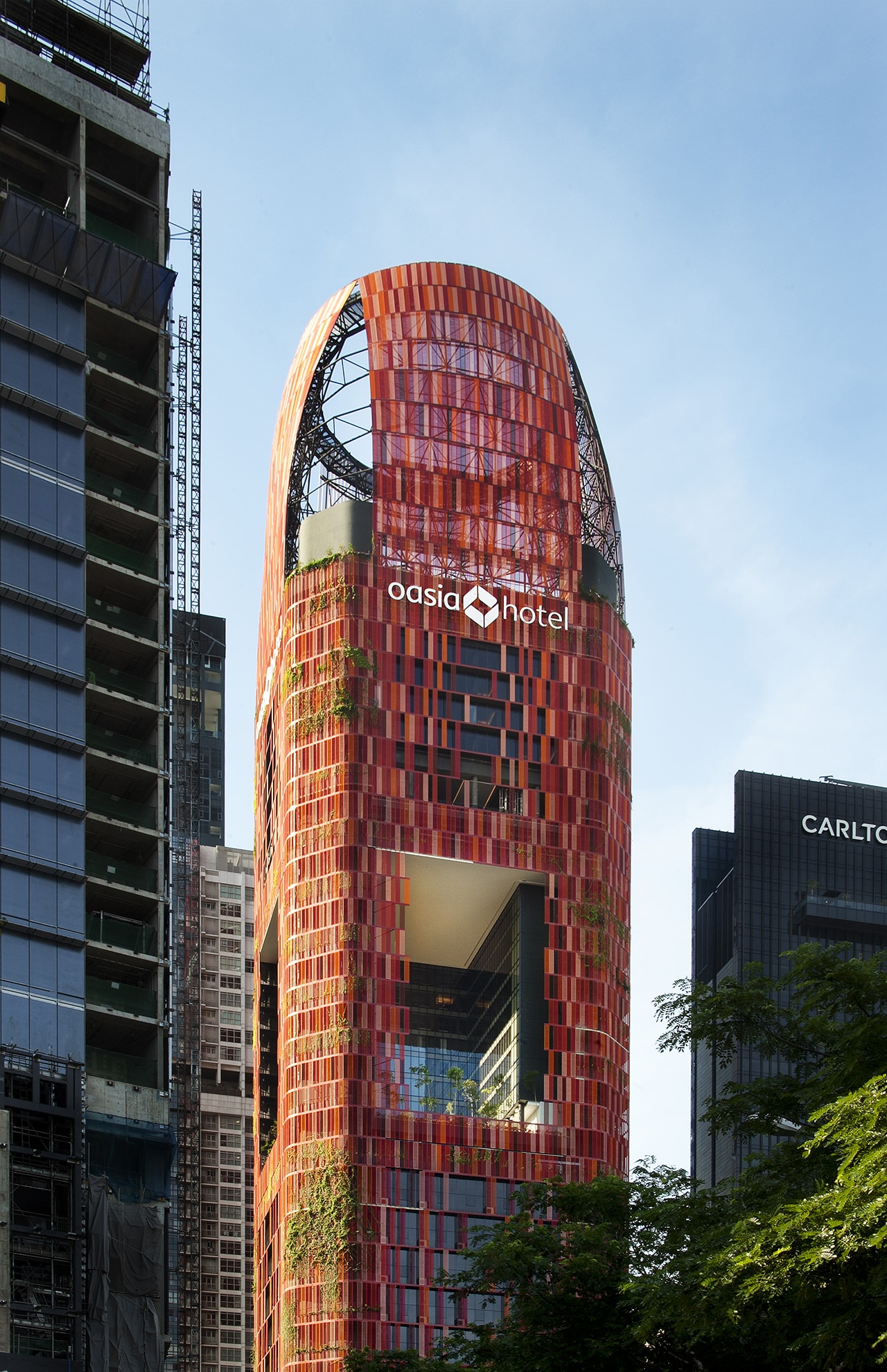 Singapore. WOHA architects designed a red tower filled with green creepers