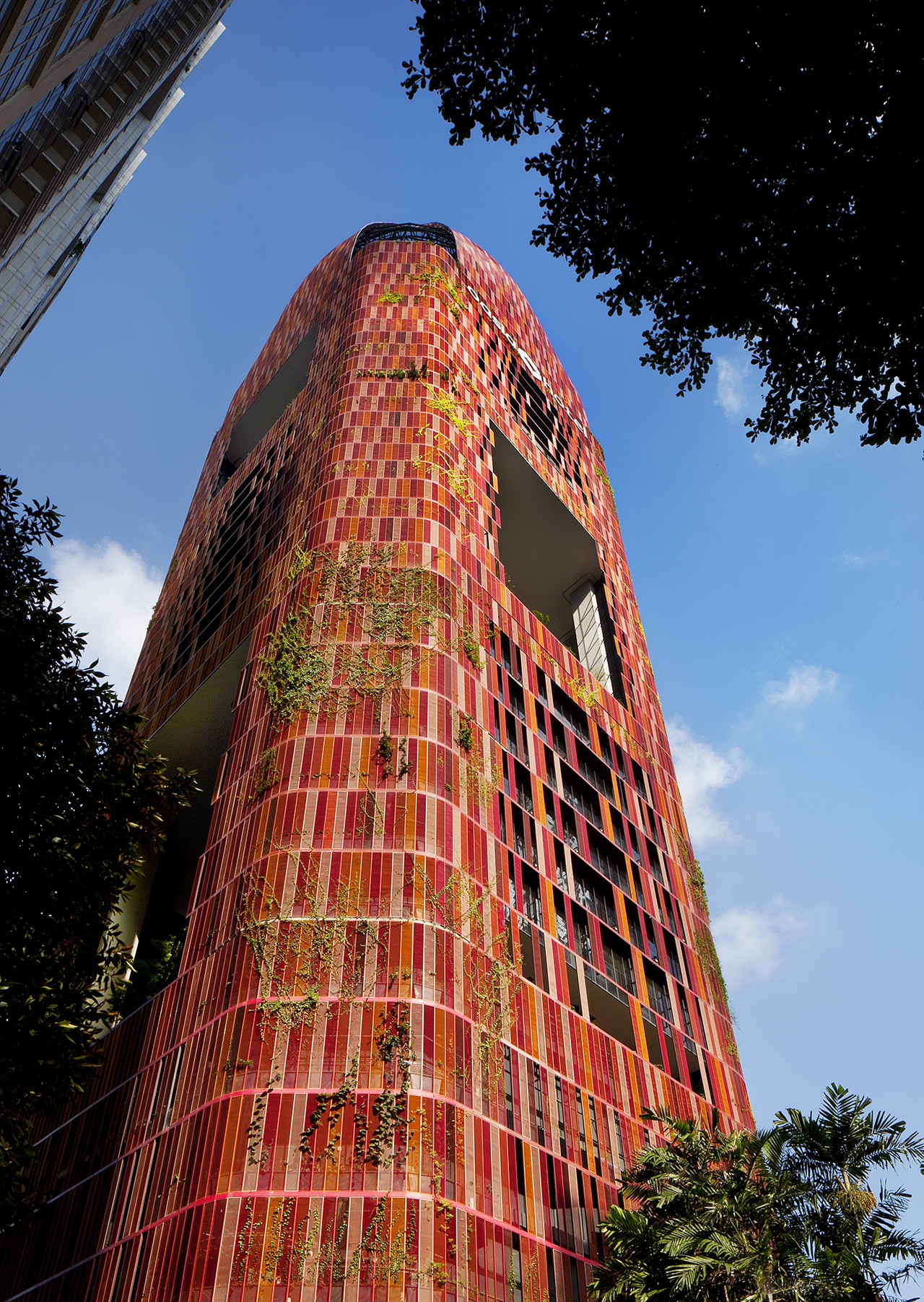 Singapore. WOHA architects designed a red tower filled with green creepers