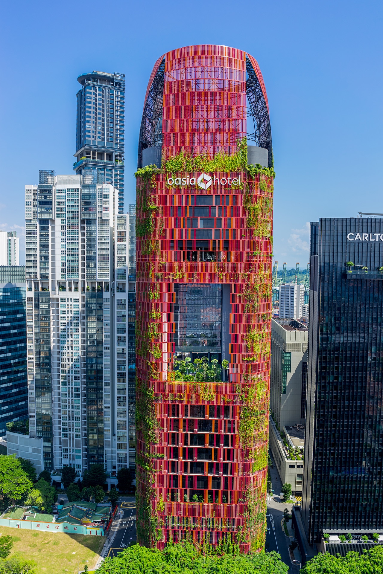 Singapore. WOHA architects designed a red tower filled with green creepers