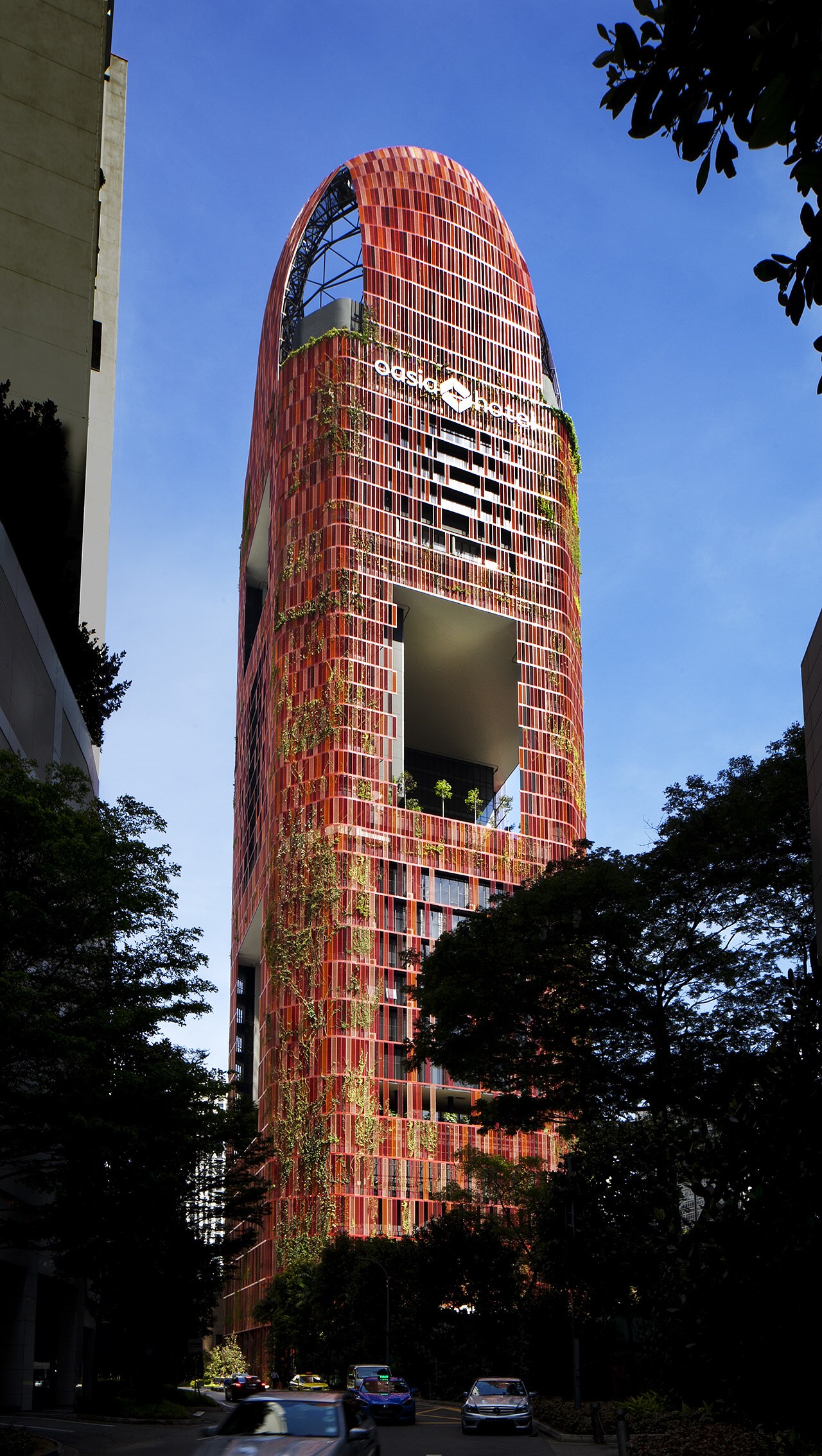 Singapore. WOHA architects designed a red tower filled with green creepers