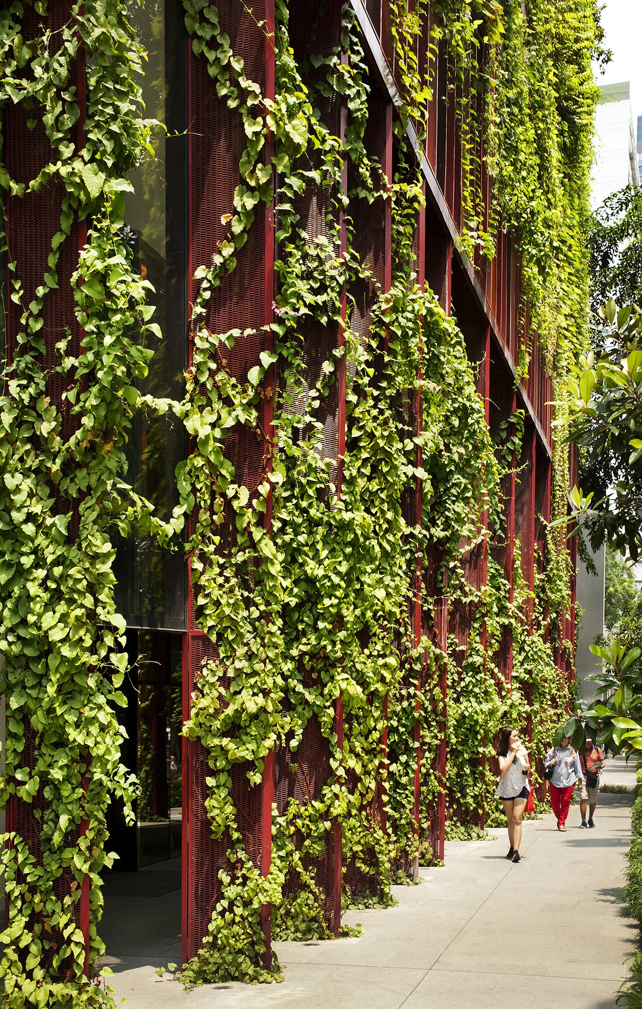 Singapore. WOHA architects designed a red tower filled with green creepers