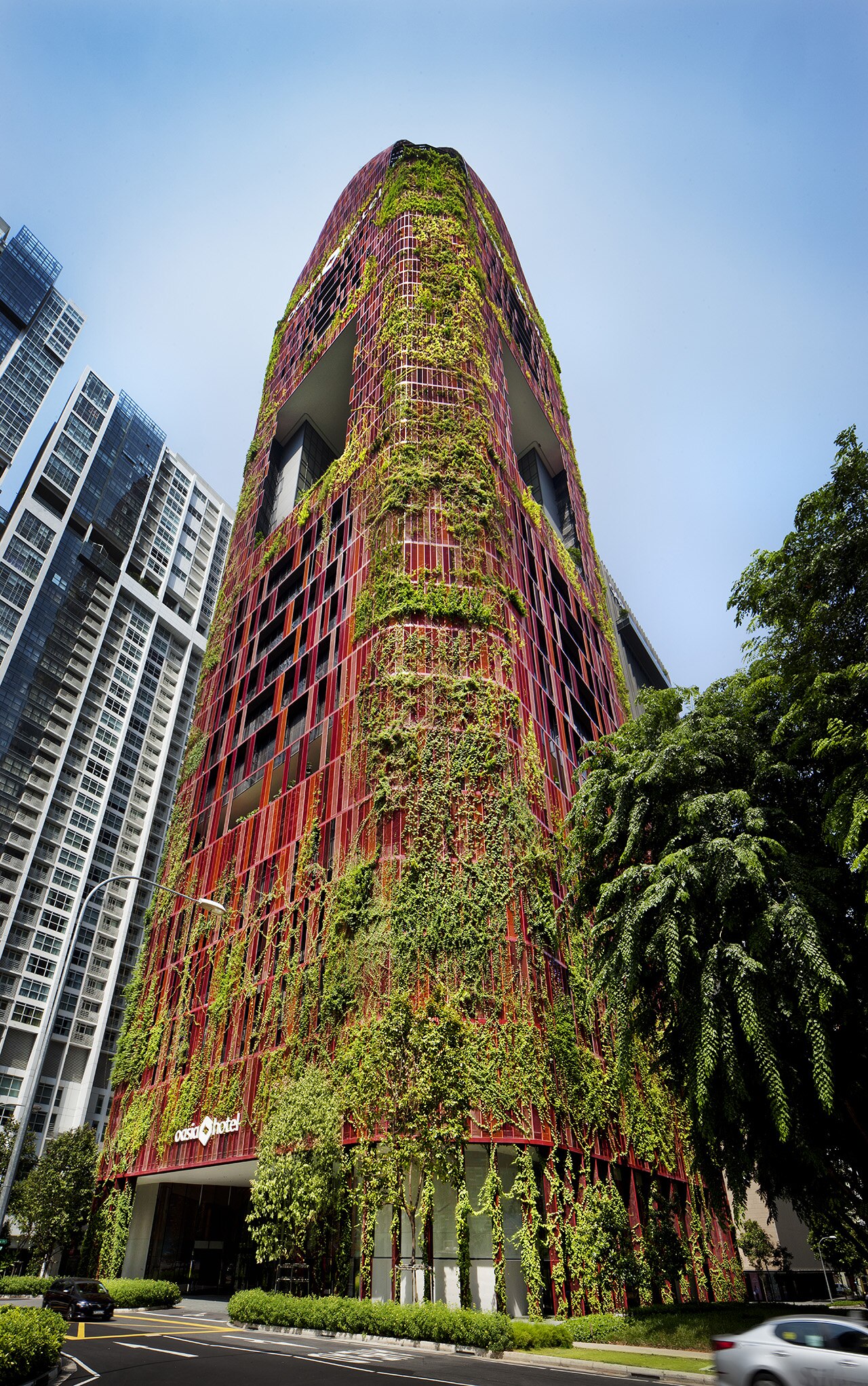 Singapore. WOHA architects designed a red tower filled with green creepers