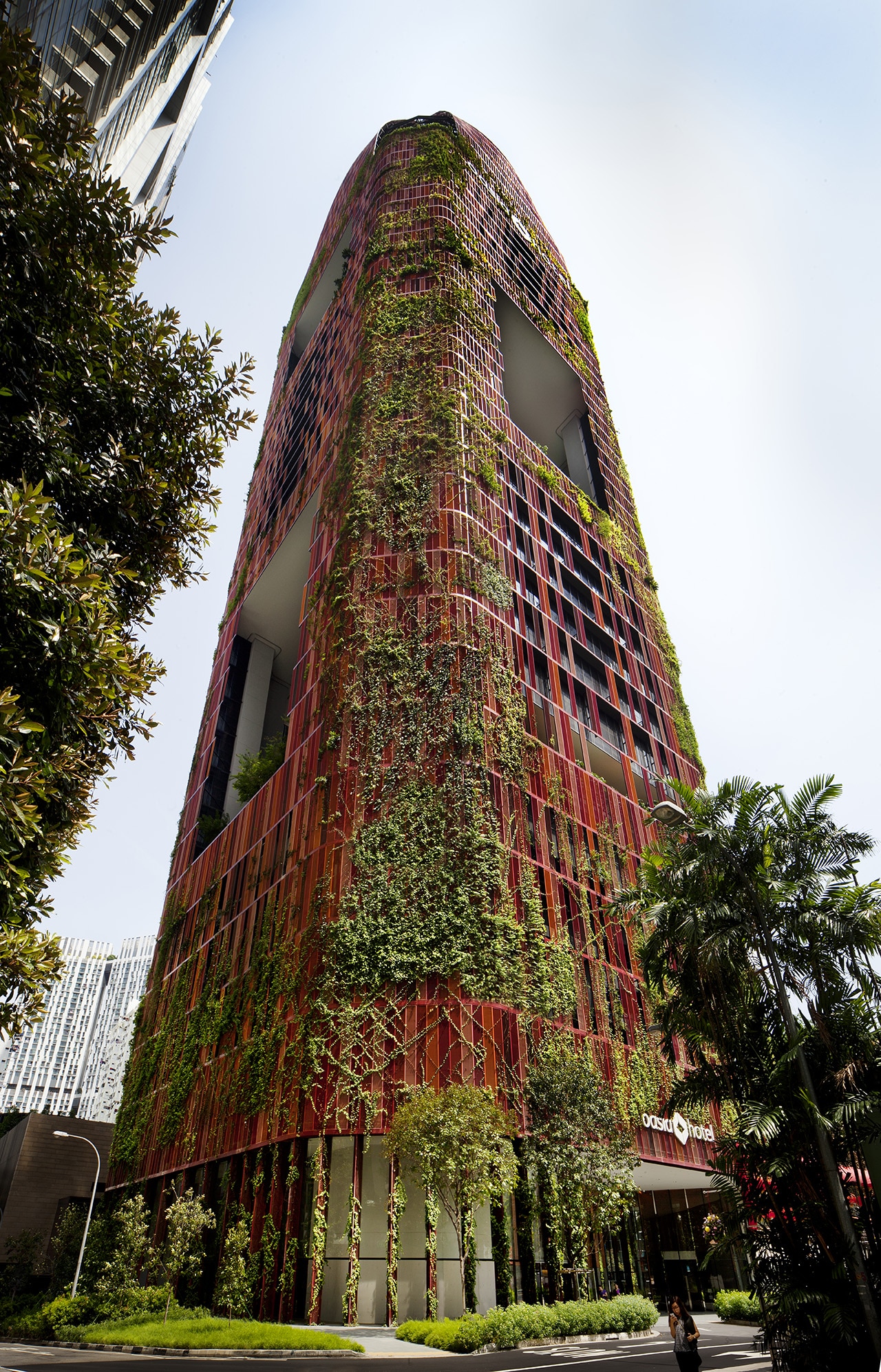 Singapore. WOHA architects designed a red tower filled with green creepers