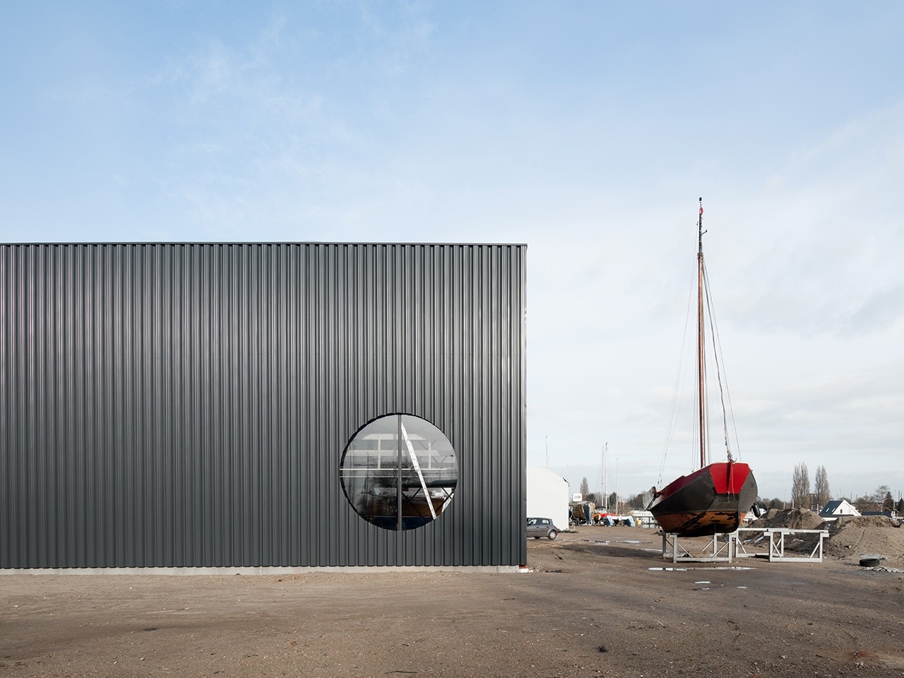 Amsterdam. A boat hangar interacting with the new life of a shipyard ...