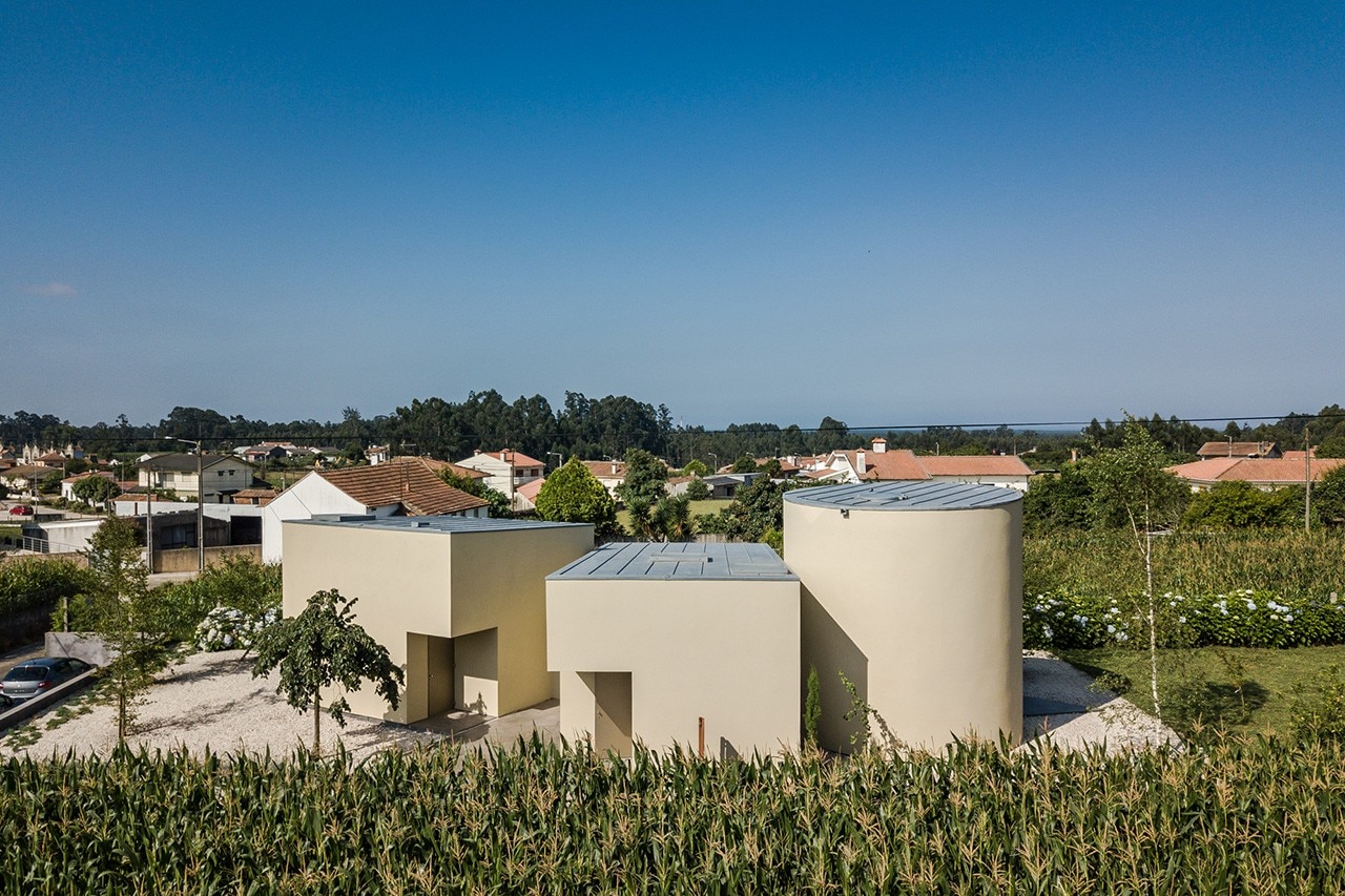 A cube, cuboid and cylinder intersect to create architecture studio in ...