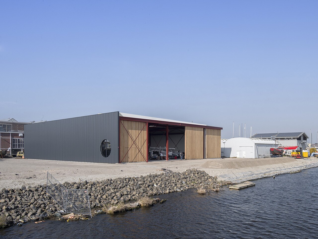 Amsterdam. A boat hangar interacting with the new life of a shipyard ...