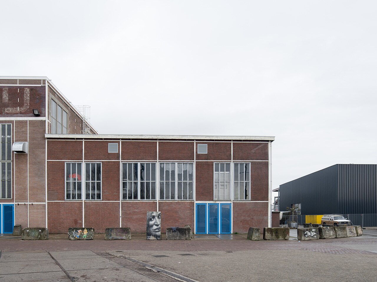 Amsterdam. A boat hangar interacting with the new life of a shipyard ...