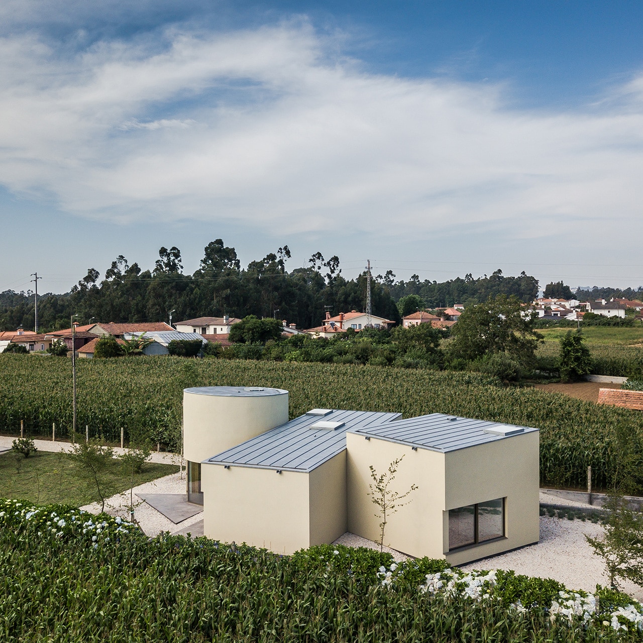 A cube, cuboid and cylinder intersect to create architecture studio in ...