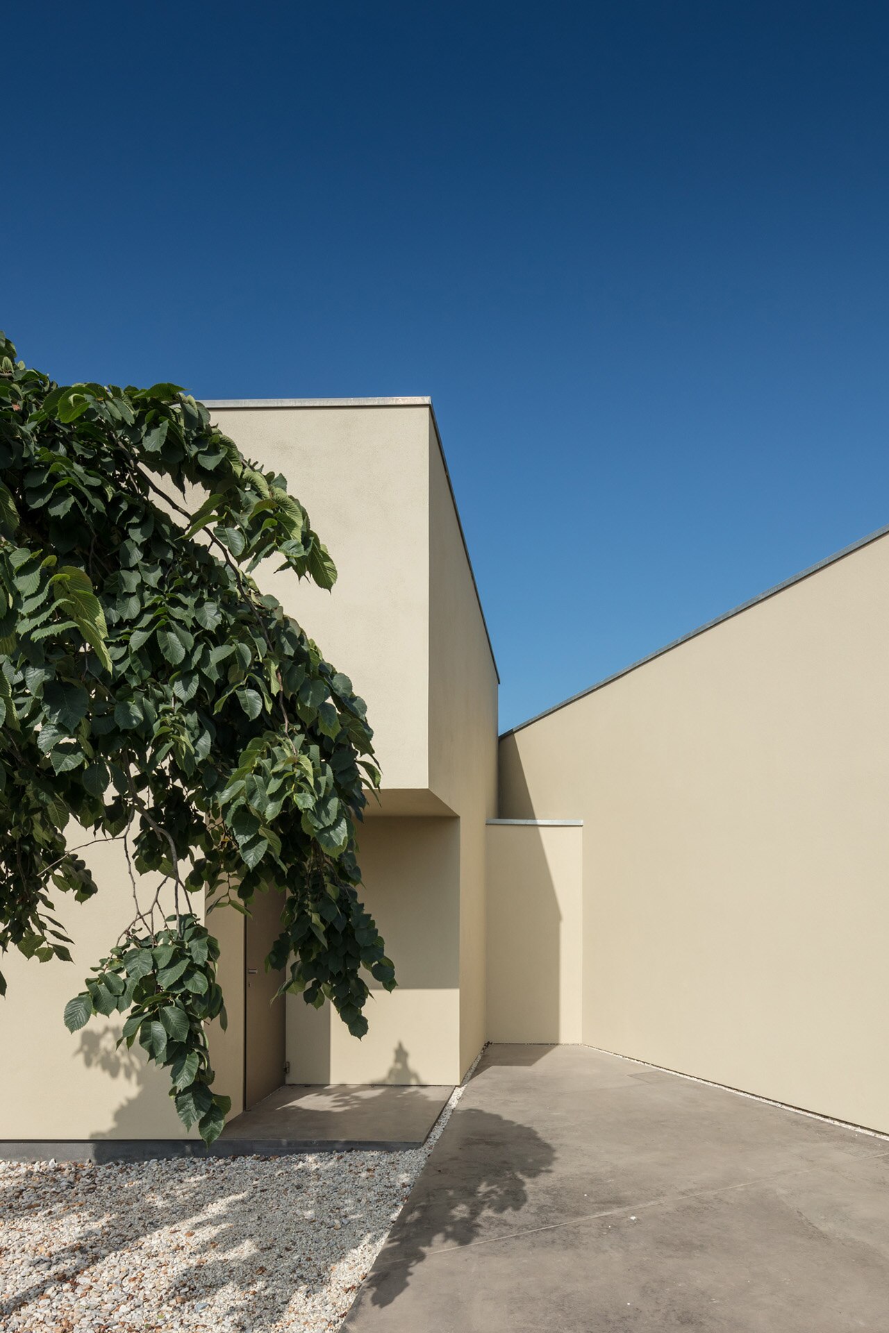 A cube, cuboid and cylinder intersect to create architecture studio in ...