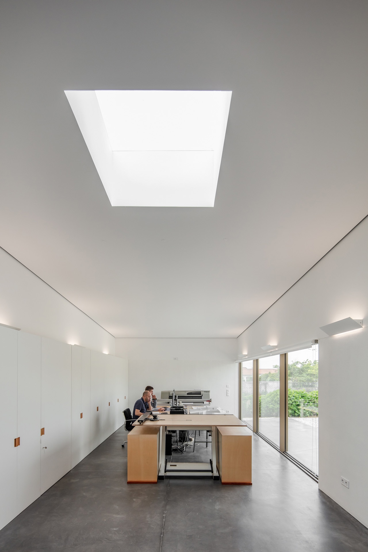 A cube, cuboid and cylinder intersect to create architecture studio in ...