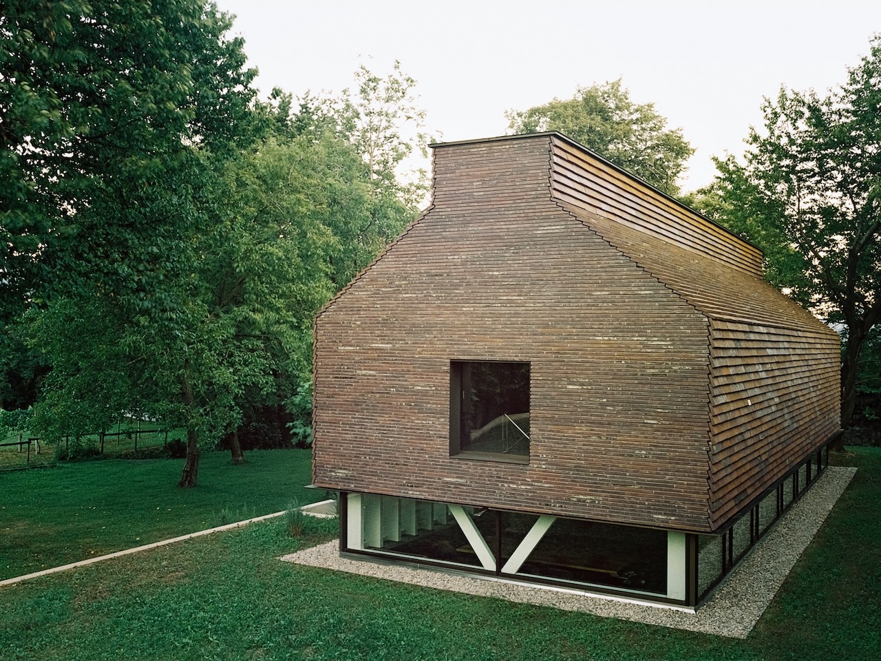 Stocker Lee architects designed a Swiss atelier covered in wooden shingle