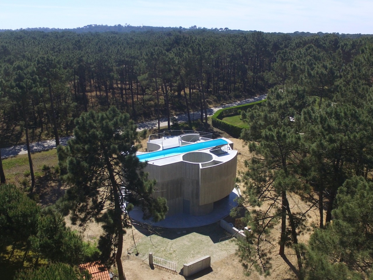 Trefoil House by Double O Studio features rooftop pool and sky views