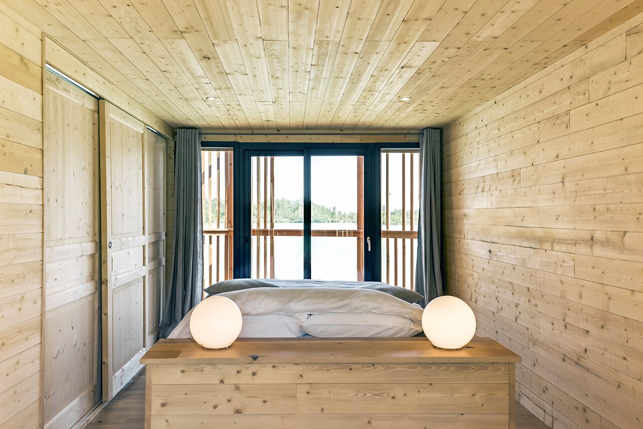 An Eco-hotel on the lake by Atelier Lavit, located in Châteauneuf-du ...