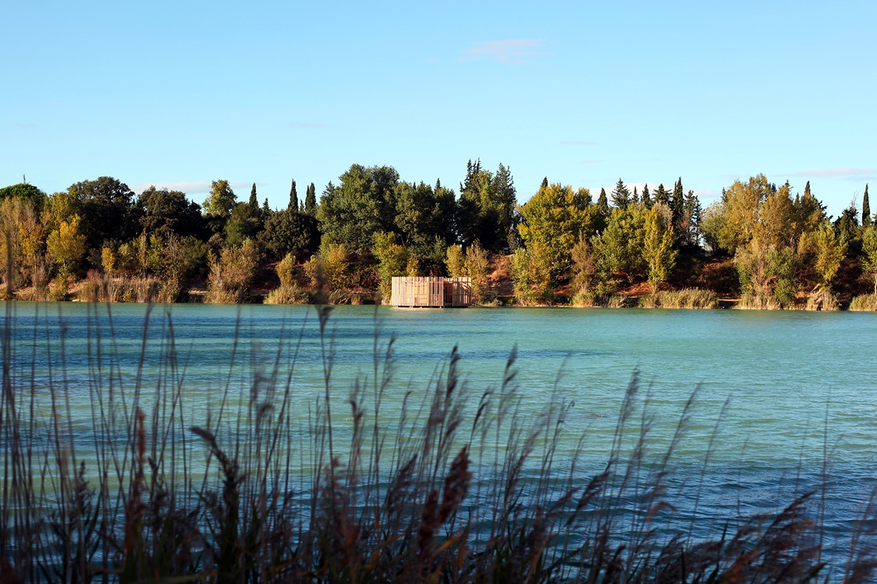 An Eco-hotel on the lake by Atelier Lavit, located in Châteauneuf-du ...