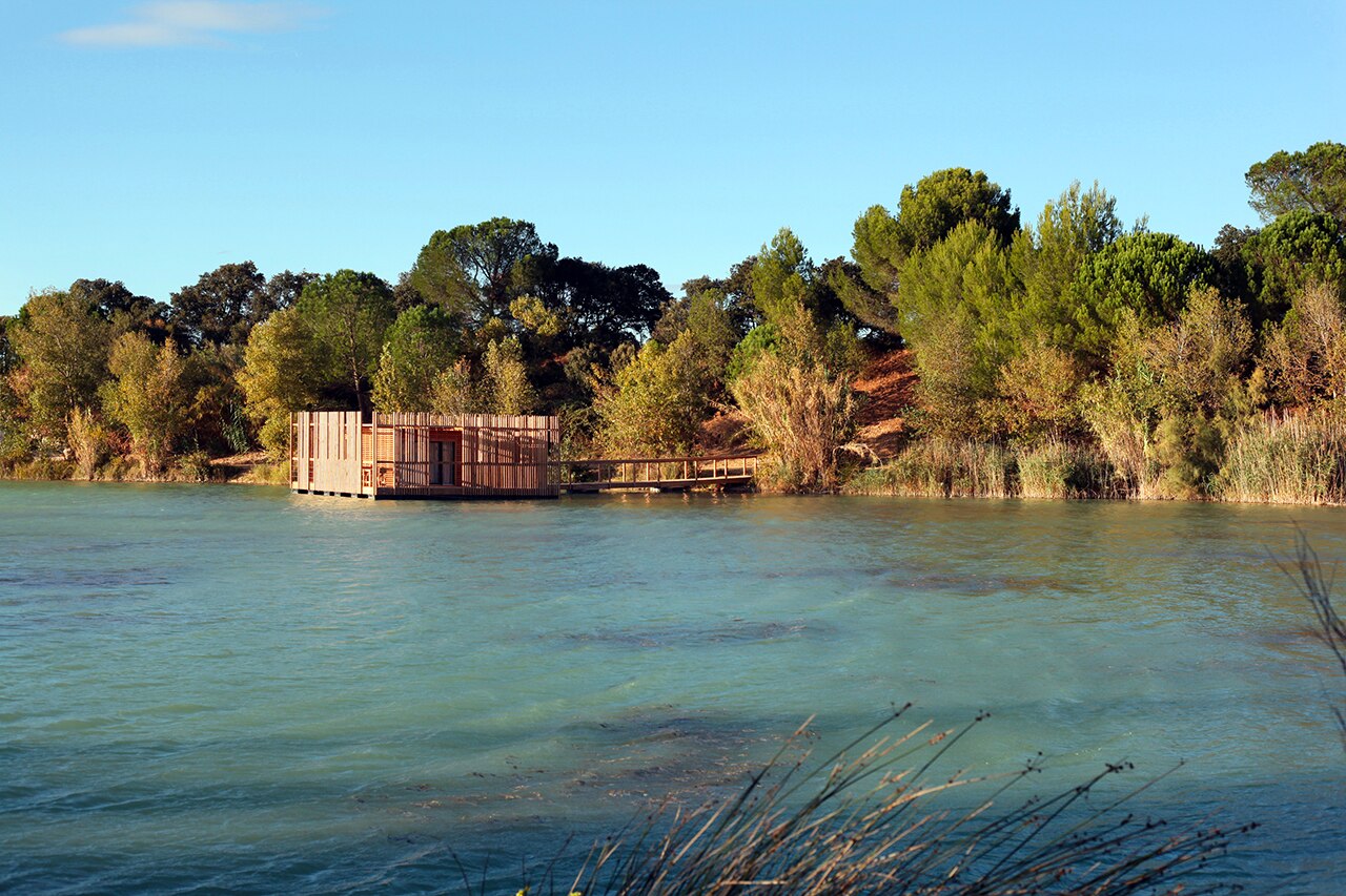 An Eco-hotel on the lake by Atelier Lavit, located in Châteauneuf-du ...