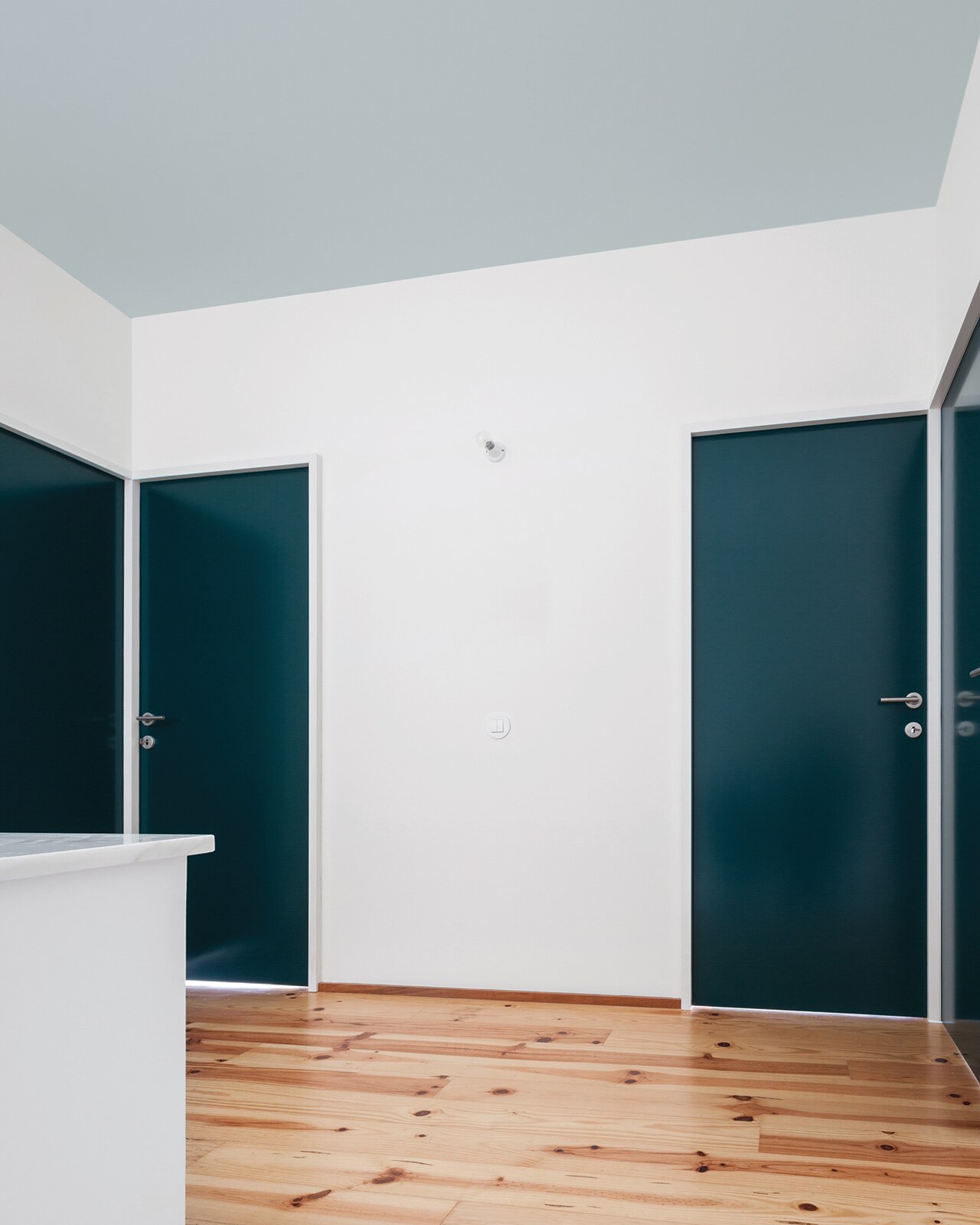 Fala Atelier completes three adjacent houses with garden in Portugal