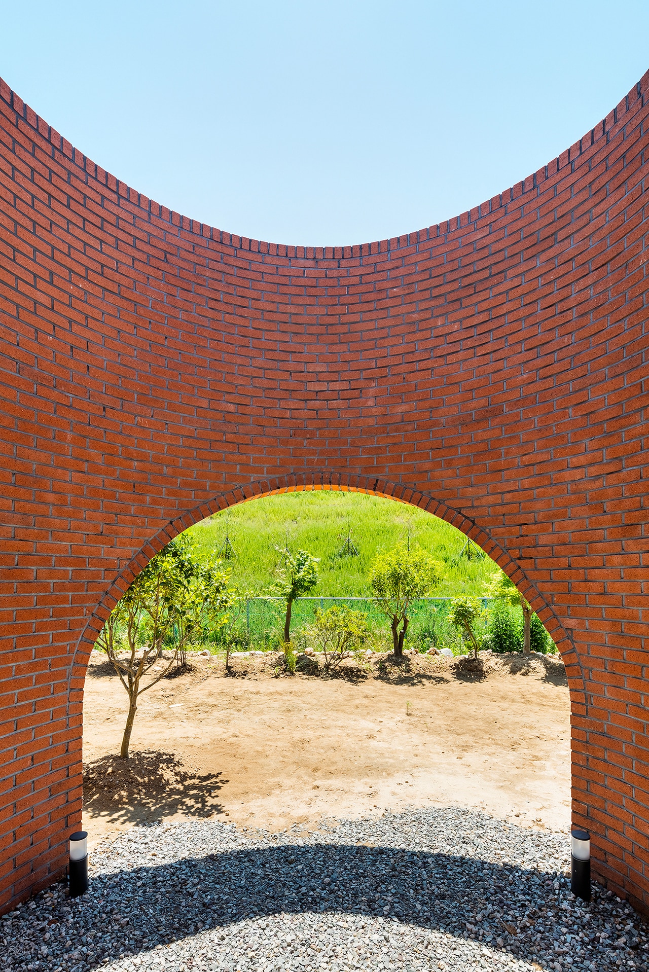 A brick house with curvy walls - Domus